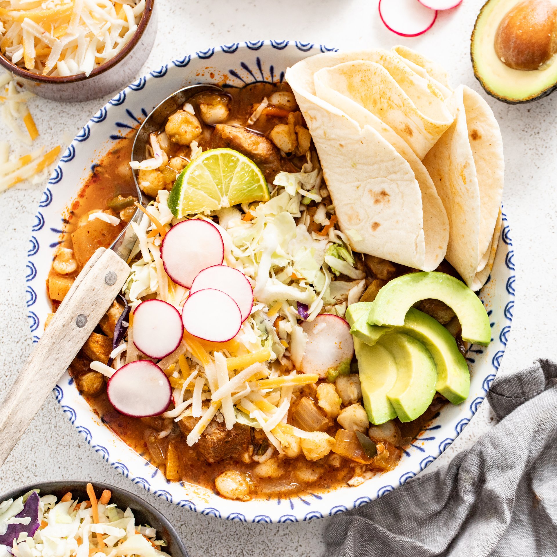 Slow Cooker Pozole Rojo with Pork, Cheese, Shredded Cabbage, Avocado ...