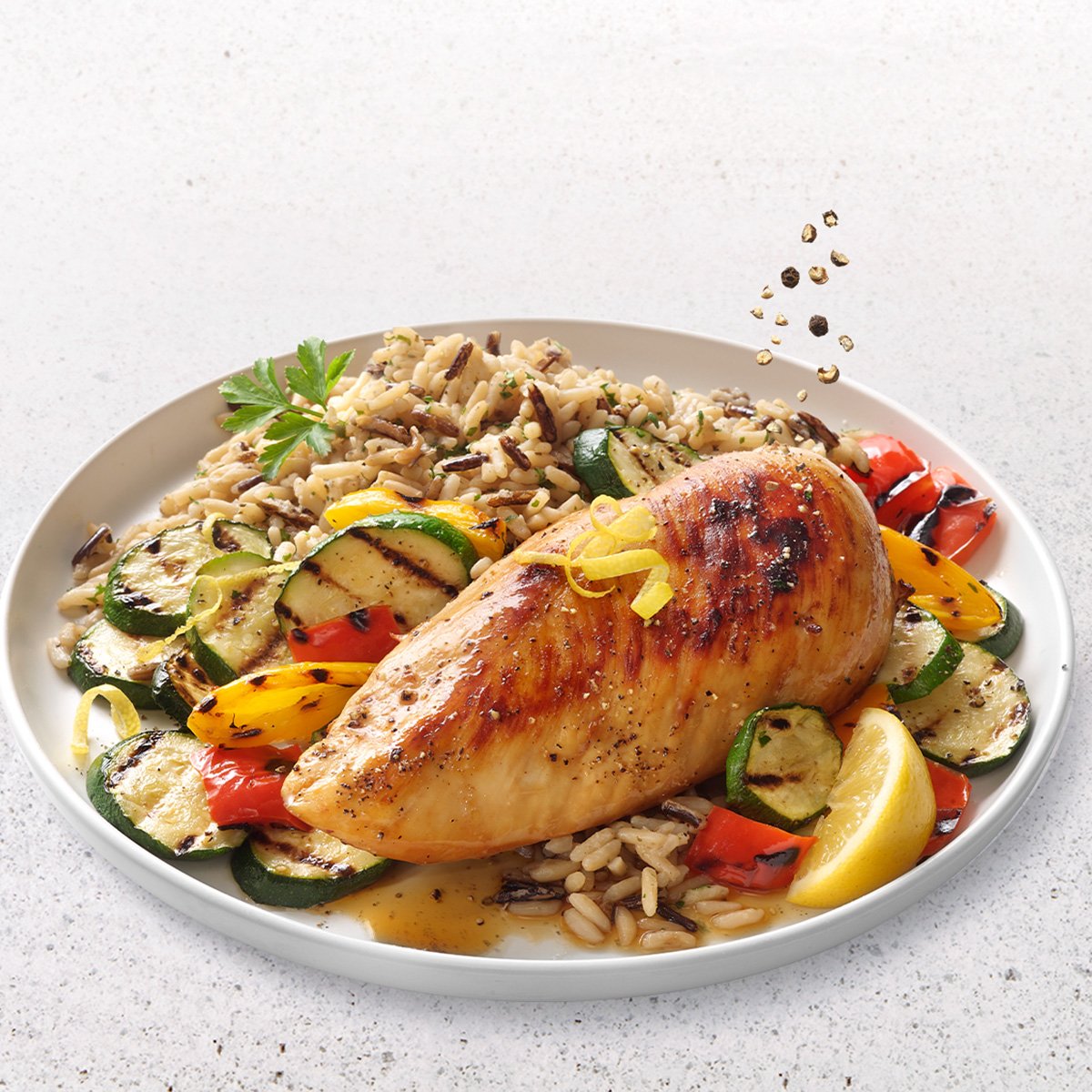 Seared Lemon Peppercorn Chicken Breast with Rice Pilaf & Grilled ...