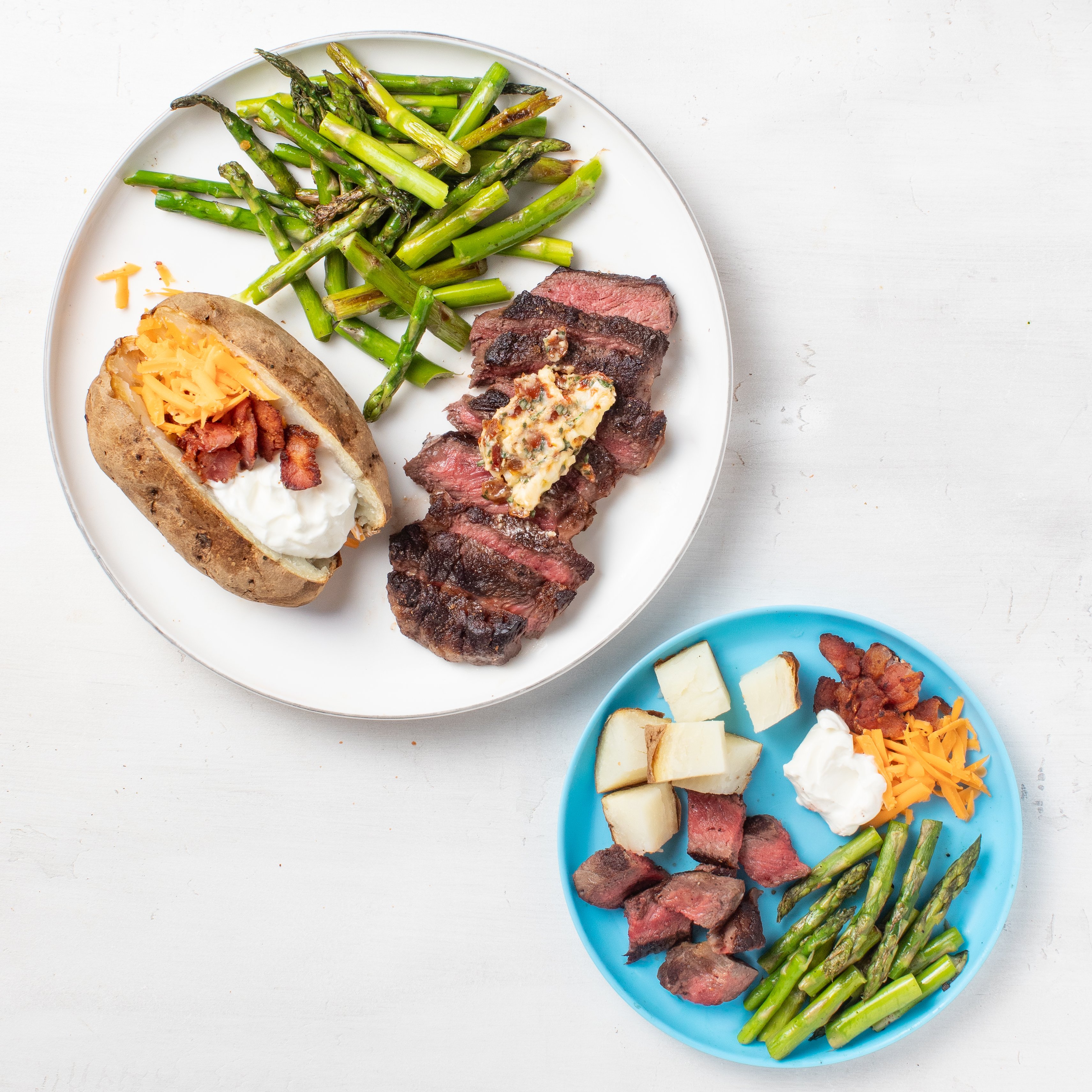NY Steak with Tomato-Basil Compound Butter, Asparagus & Loaded Baked ...