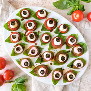 Caprese "Eyeballs" with Basil, Tomato, Mozzarella & Black Olives | Vons